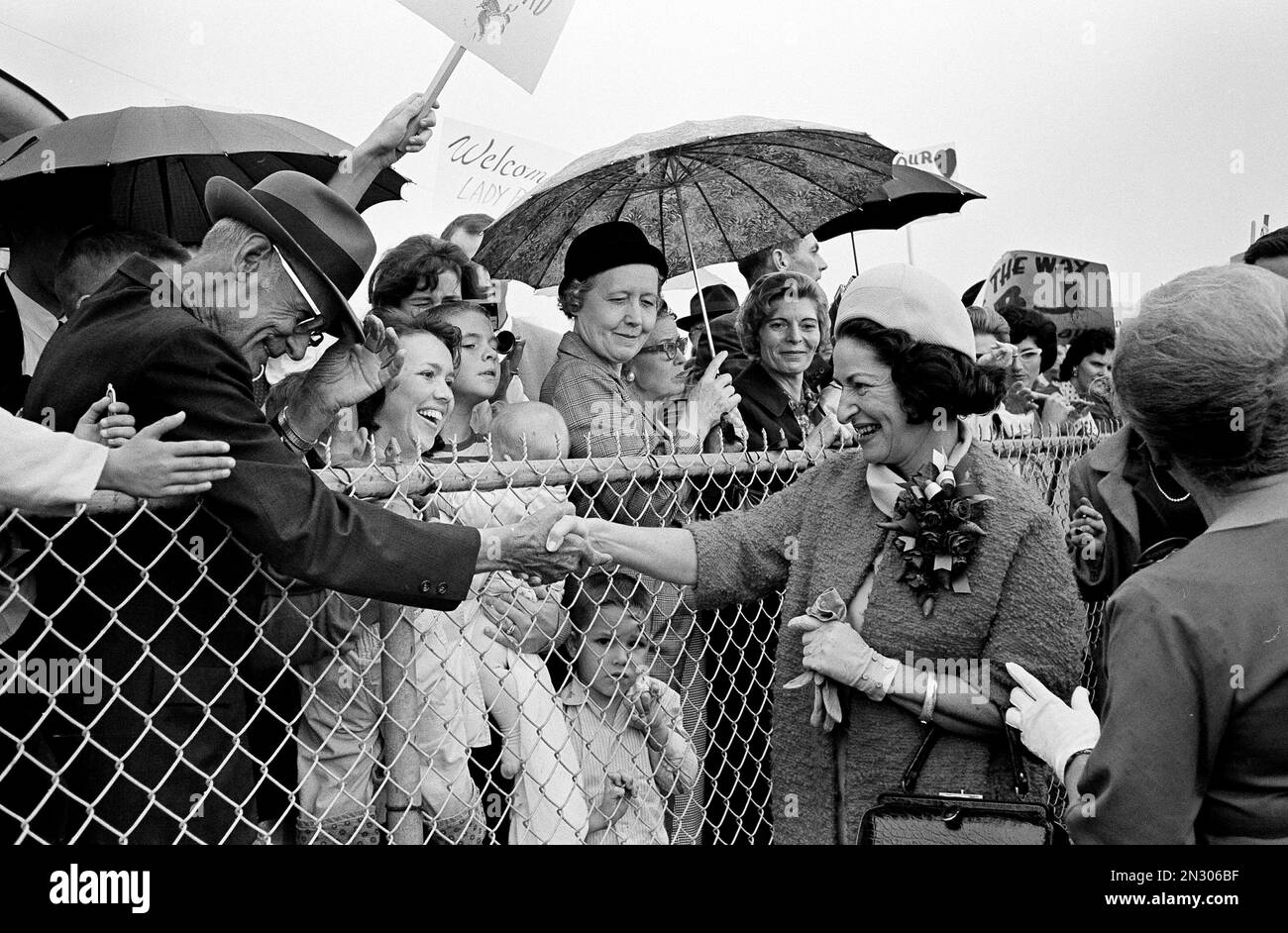 Lady Bird Johnson, wife of President Lyndon Johnson, greets well ...