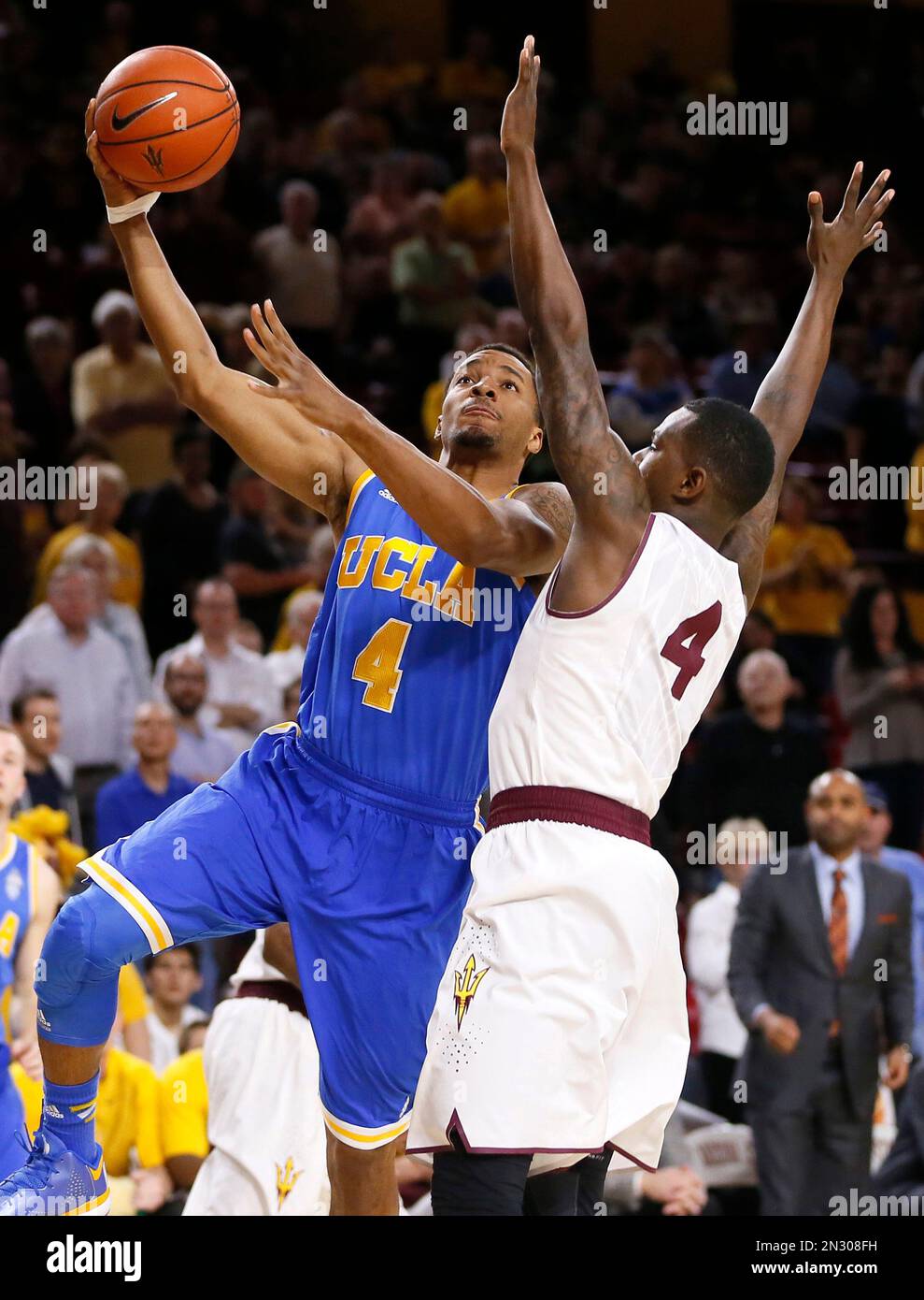 UCLA's Norman Powell, left, shoots over Arizona State's Gerry Blakes ...