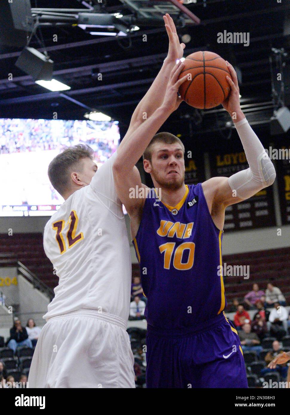 Northern Iowa forward Seth Tuttle (10) is defended by Loyola of Chicago ...