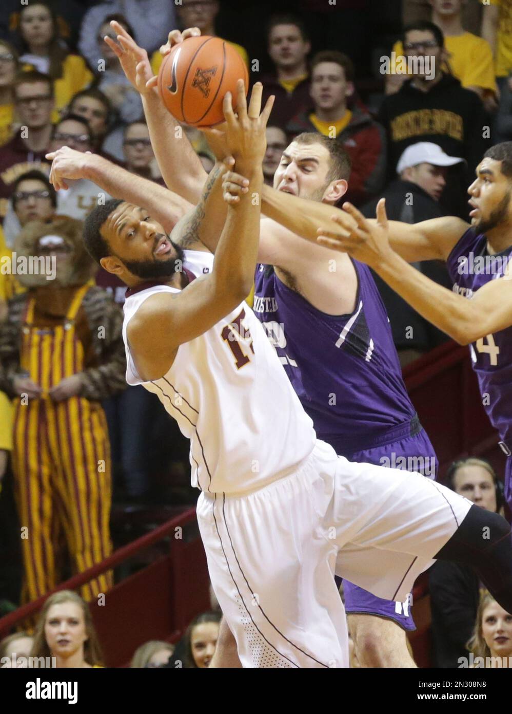 Minnesota’s Maurice Walker, left, is double-teamed by Northwestern’s ...