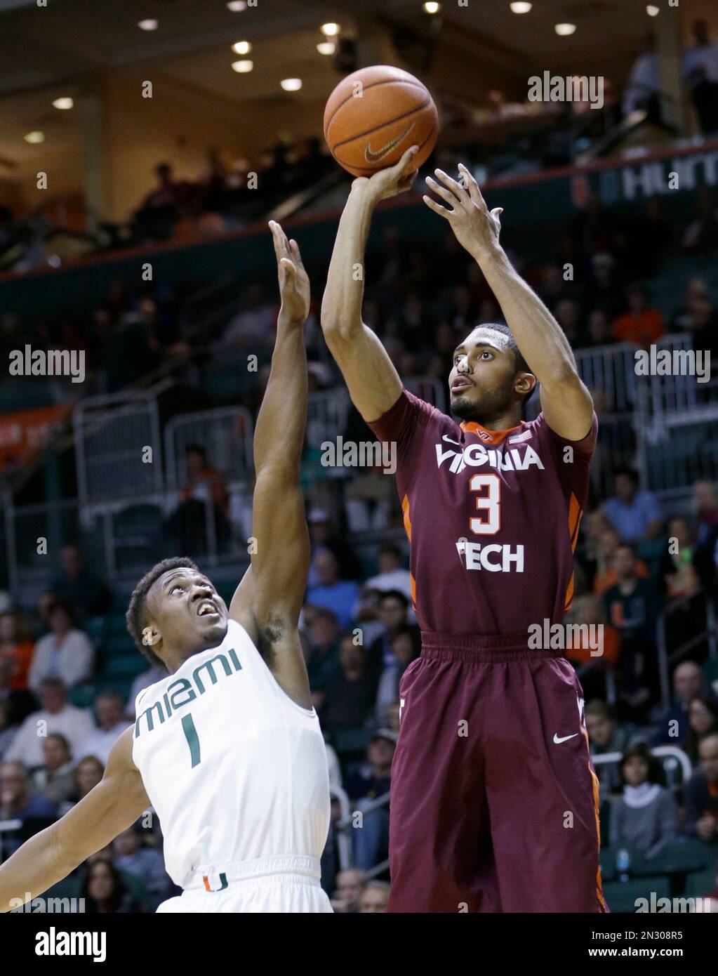 Virginia Tech guard Adam Smith (3) goes up for a shot against Miami ...