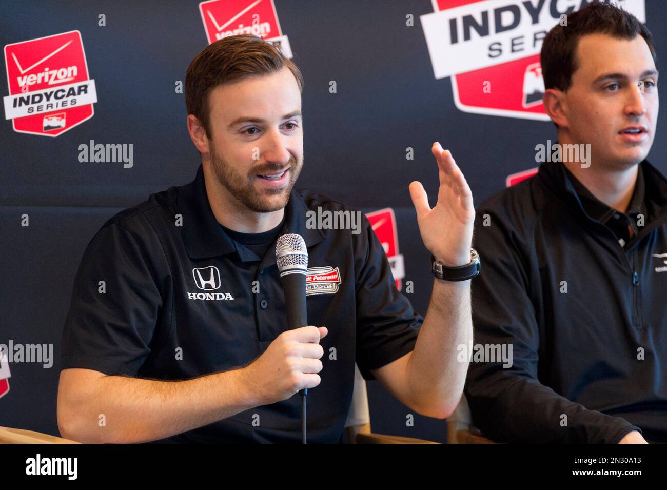 IndyCar driver James Hinchcliffe of Canada talks with reporters during ...