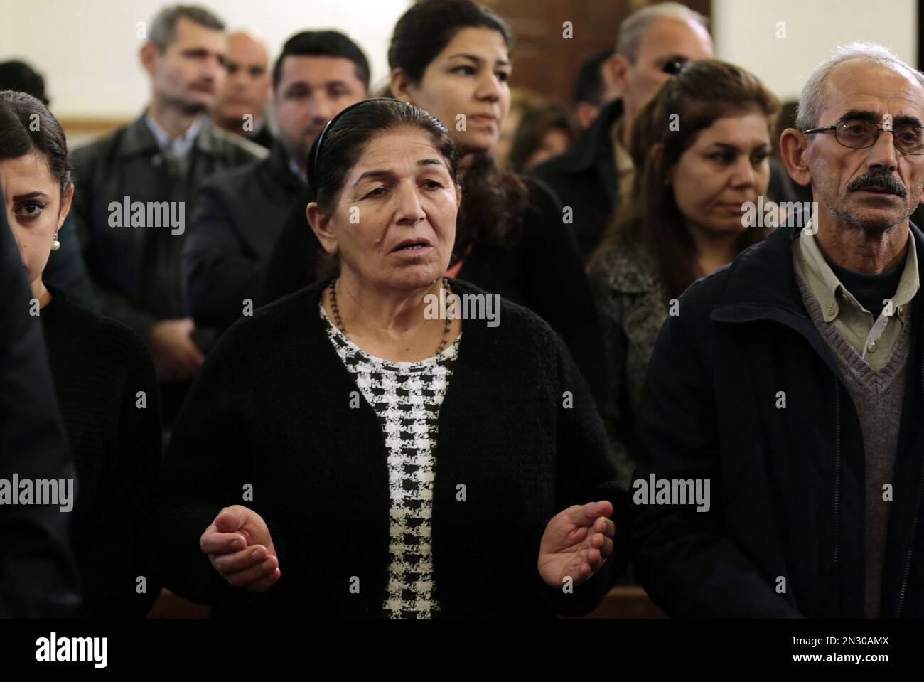 A Jordanian woman prays for Egyptian Christians who were killed in ...