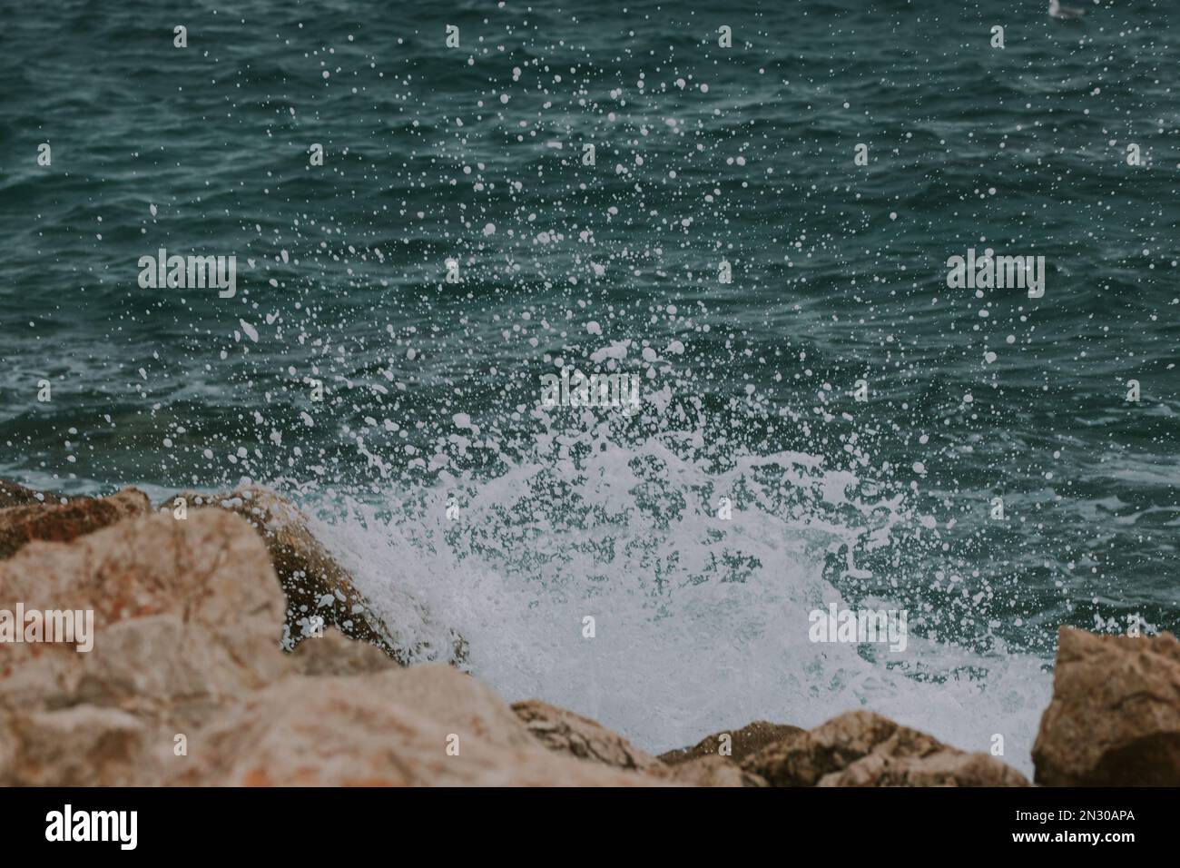 Smashing rocks hi-res stock photography and images - Alamy