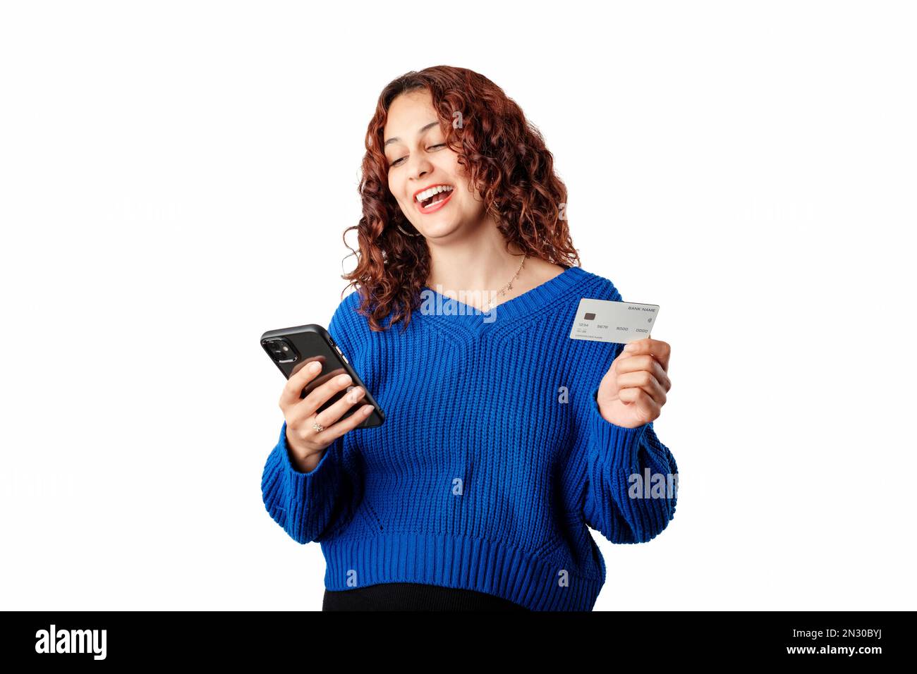 Young girl smiling happy wearing blue sweater isolated over white ...