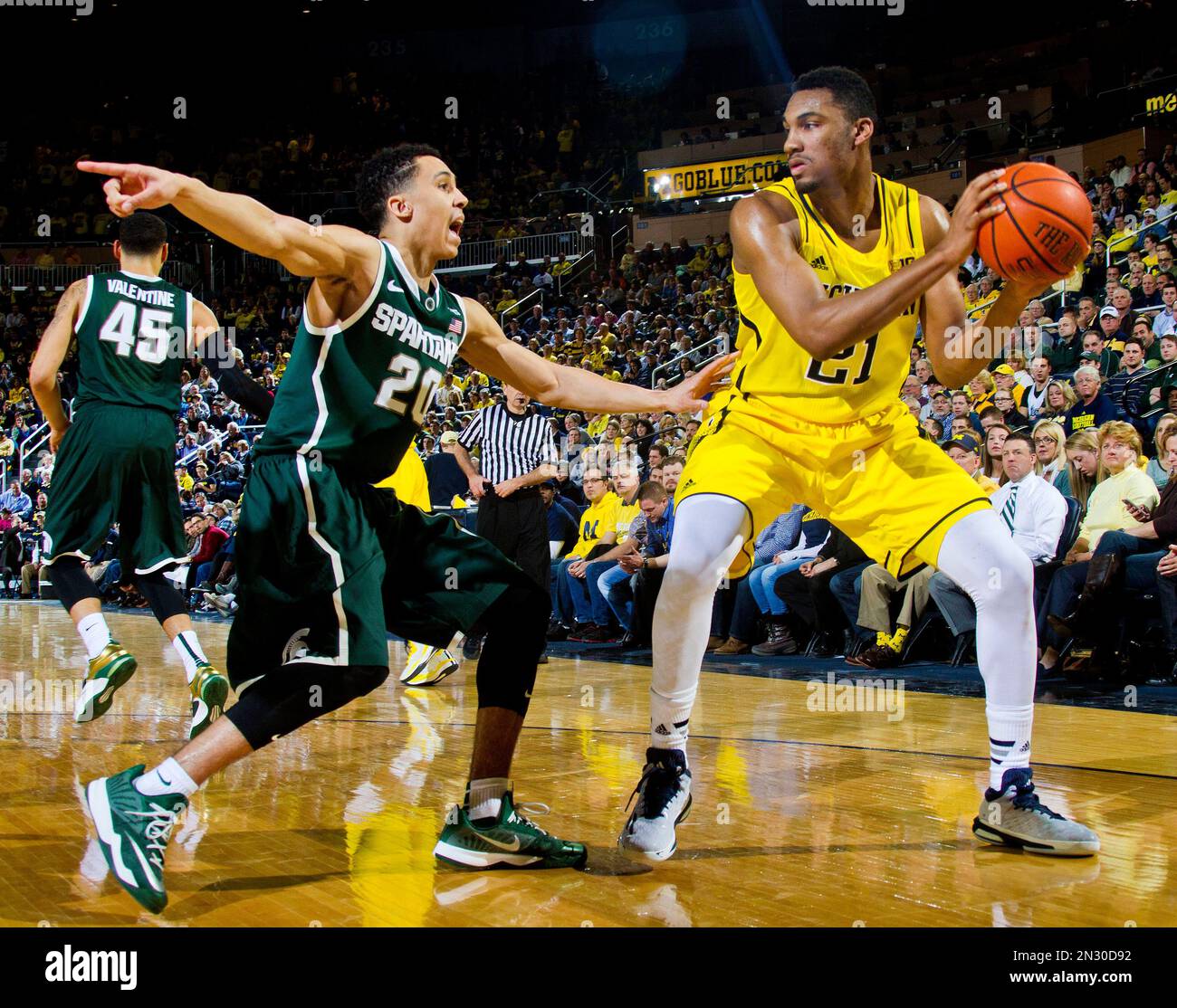 Michigan State guard Travis Trice (20) defends Michigan guard Zak Irvin ...