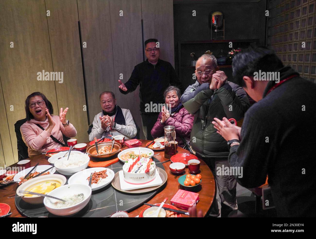 Beijing, China. 7th Feb, 2023. A tourist (2nd R) from Hong Kong ...