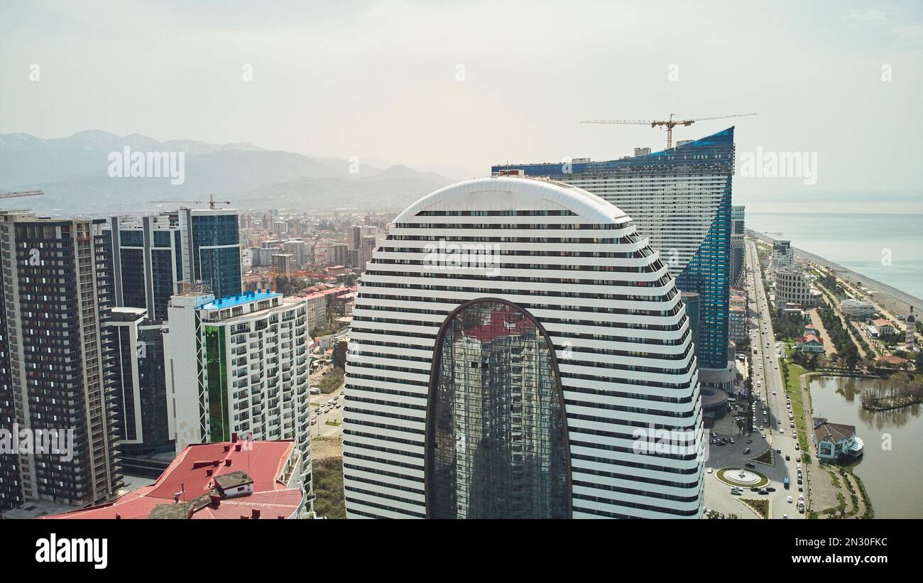 Aerial view of the modern architecture of Batumi with mountains ...