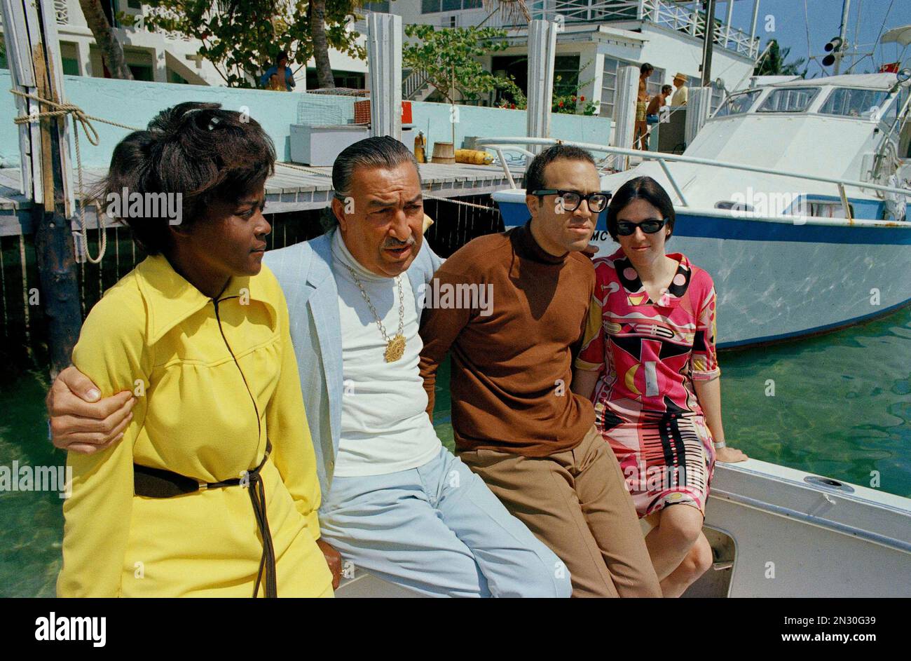Rep. Adam Clayton Powell Jr. is pictured with his family by his boat ...