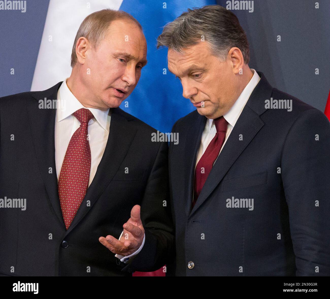 Russian President Vladimir Putin, left, speaks to Hungarian Prime ...