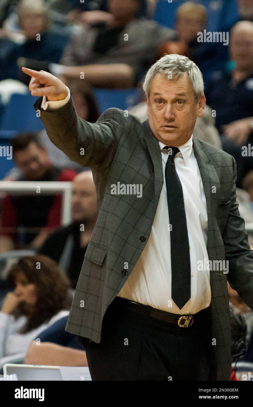 Craig Neal, head coach for New Mexico, signals to players while playing ...