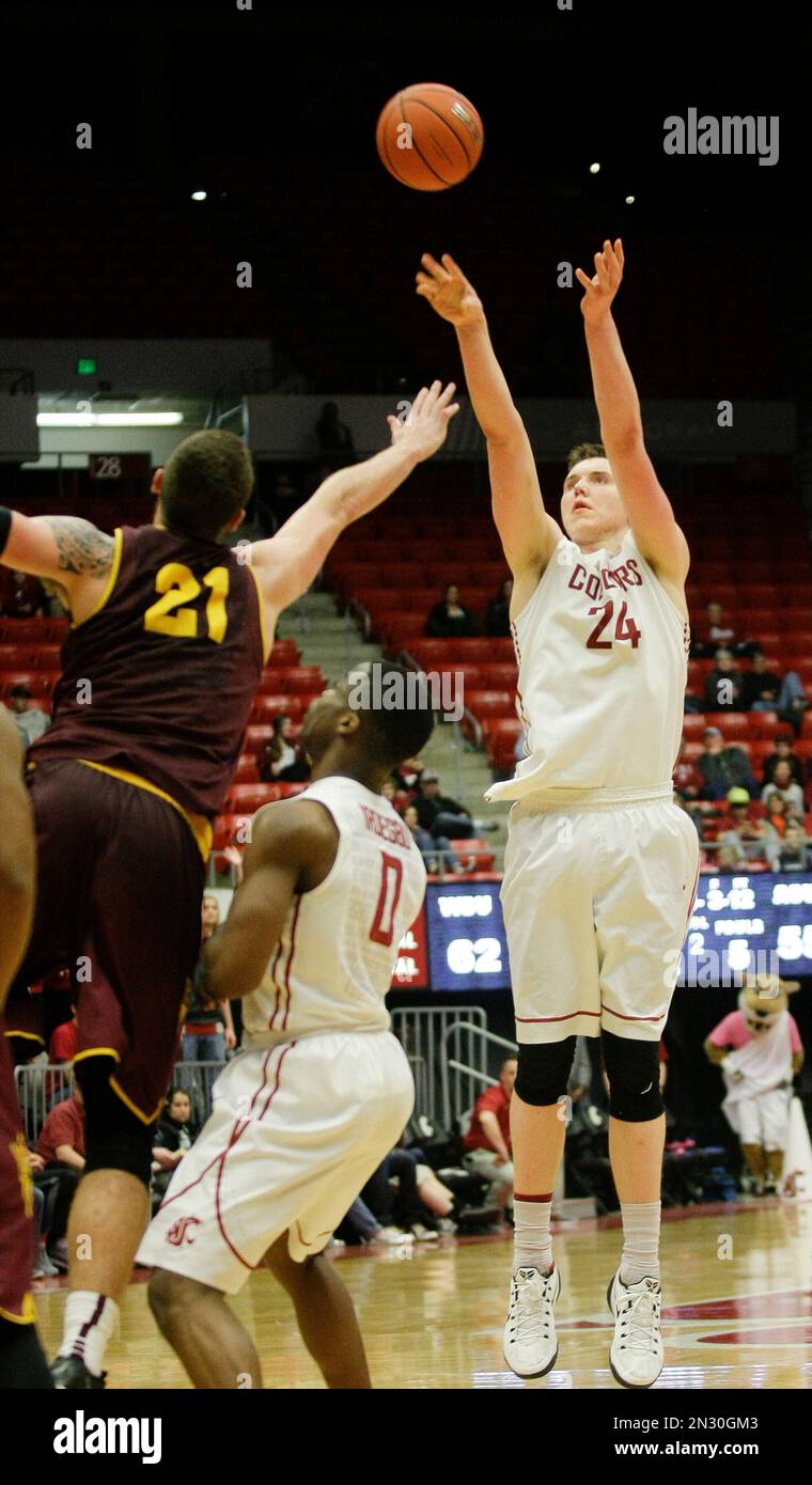 Washington State forward Josh Hawkinson (24) puts up a shot over ...