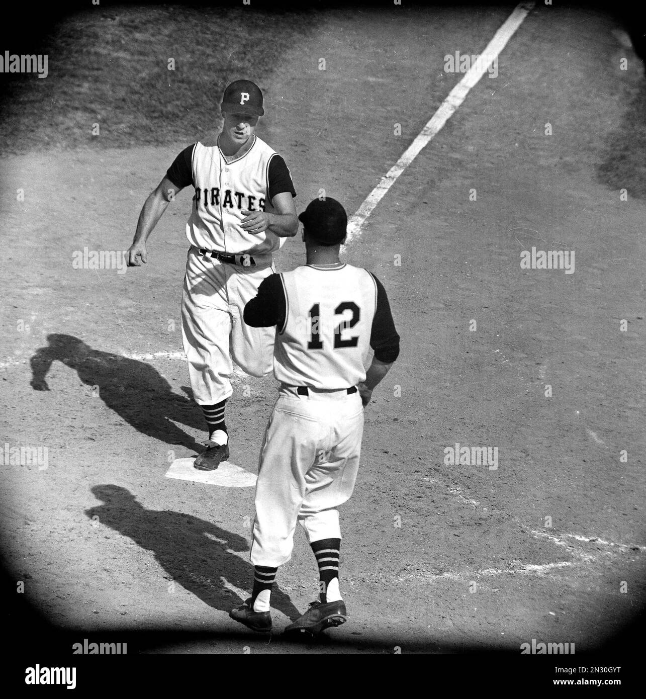 Bill Mazeroski, Pittsburgh Pirates second baseman, is greeted at home ...