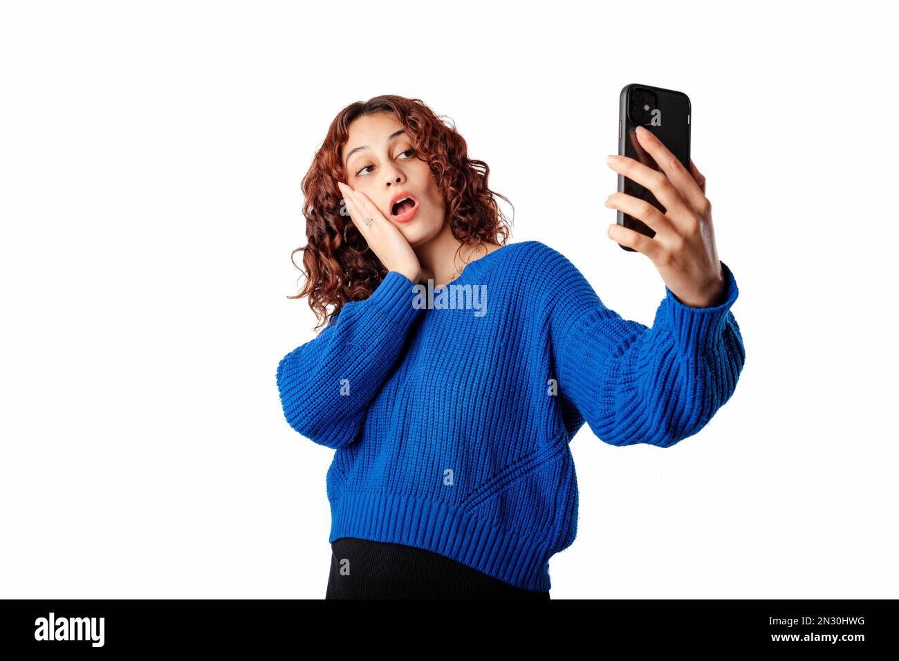 Young beautiful woman wearing blue sweater isolated over white ...