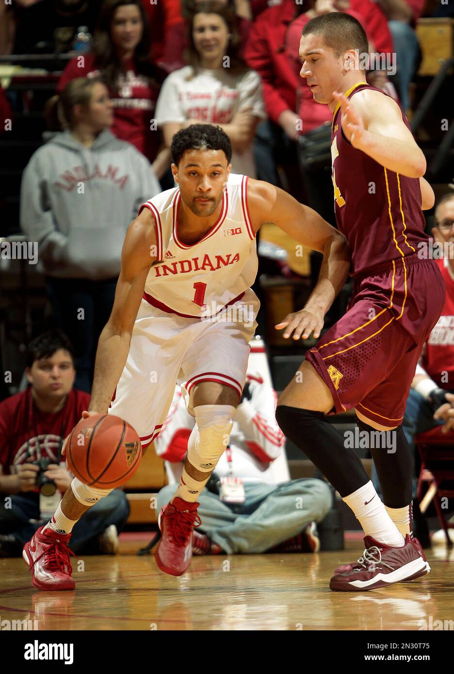 Indiana guard James Blackmon Jr., left, dribbles around Minnesota ...
