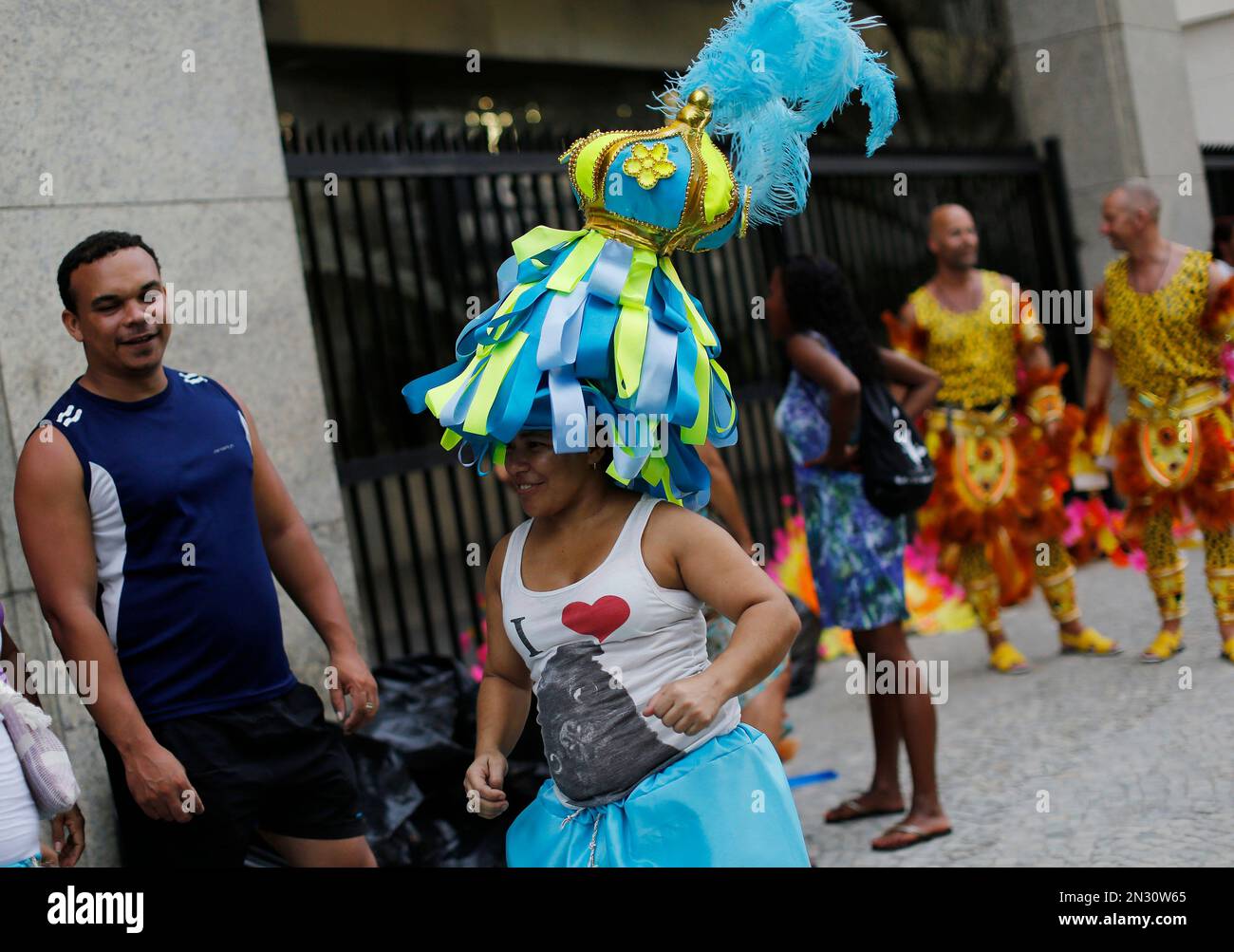 A performer jokes around as she prepares for the Carnival parade at the ...