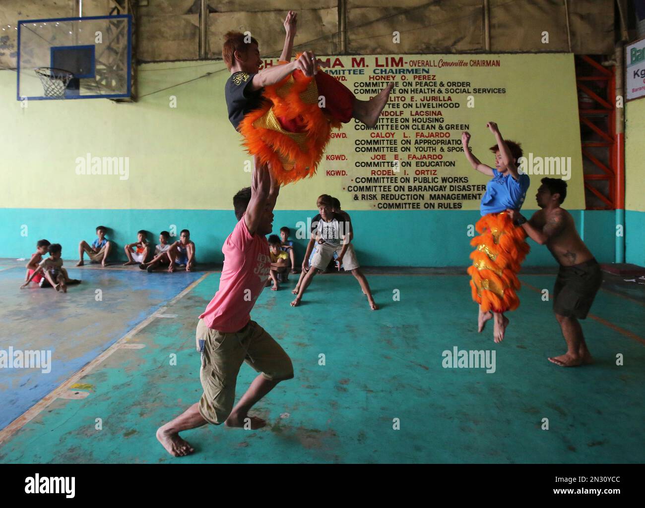 Filipino performers practice their lion dance as they prepare for ...