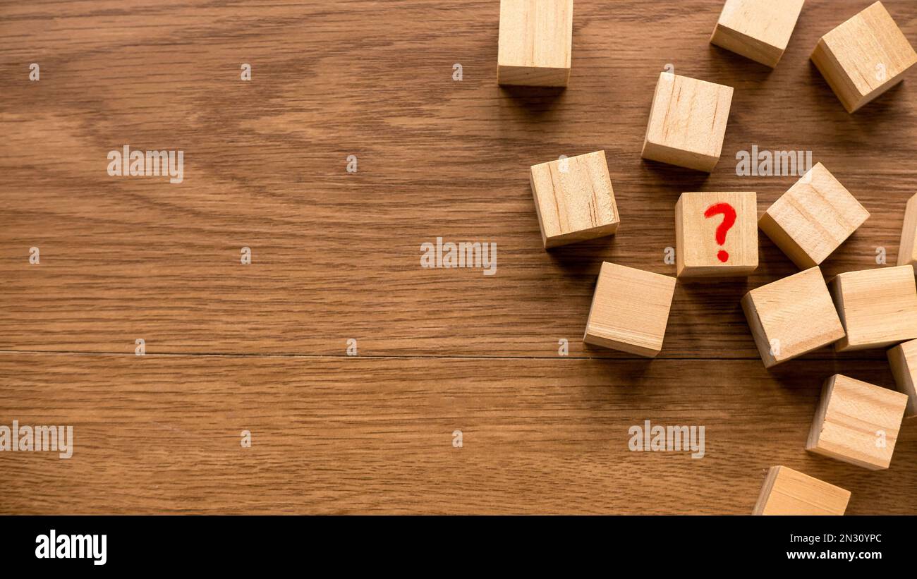 Top view of wooden cube written with Question symbol on wooden ...