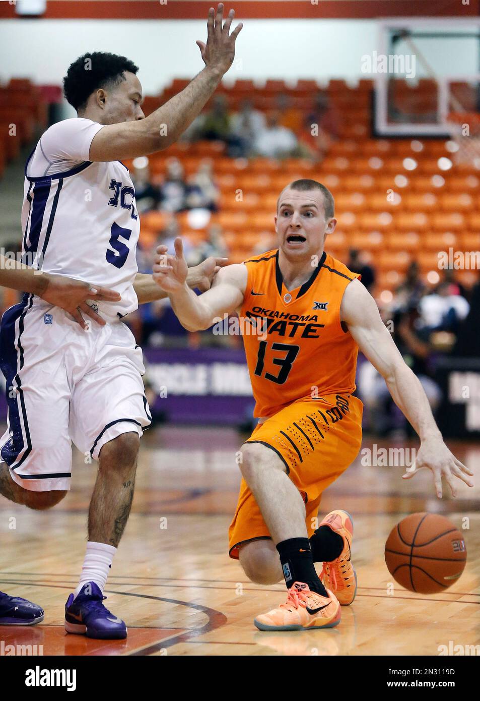 Oklahoma State guard Phil Forte III (13) looks for room against TCU ...