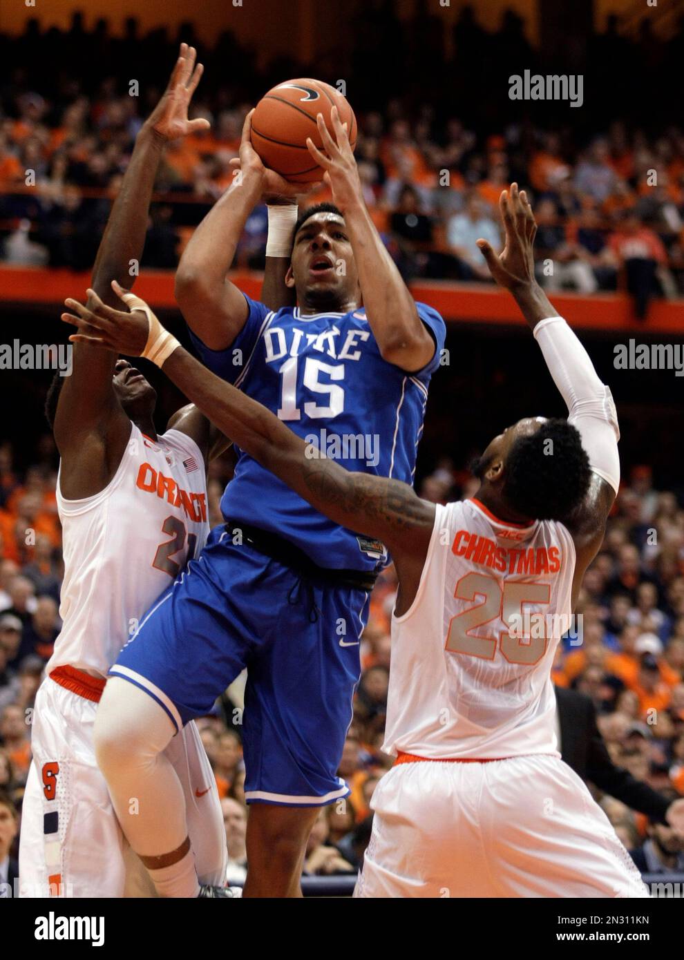 Duke’s Jahlil Okafor, center, shoots over Syracuse’s Tyler Roberson ...