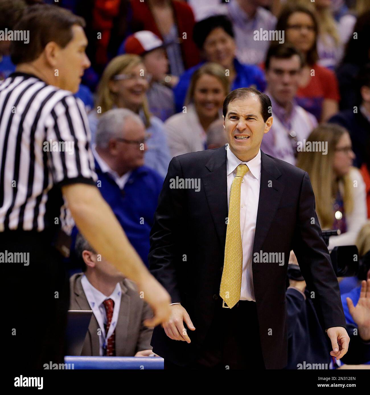 Baylor coach Scott Drew, right, questions an official during the first ...