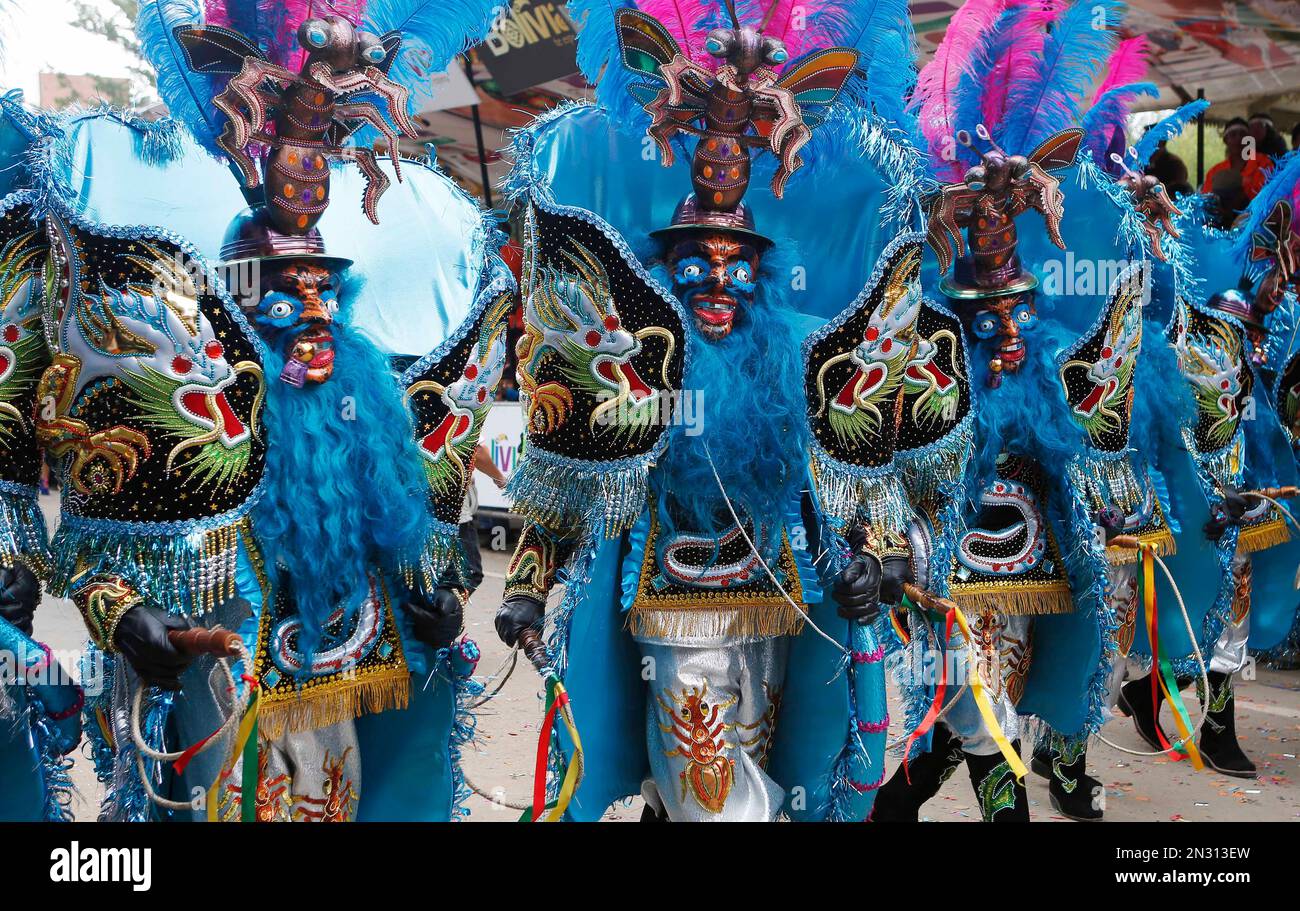 Morenanda dancers parade during the carnival celebrations in Oruro ...