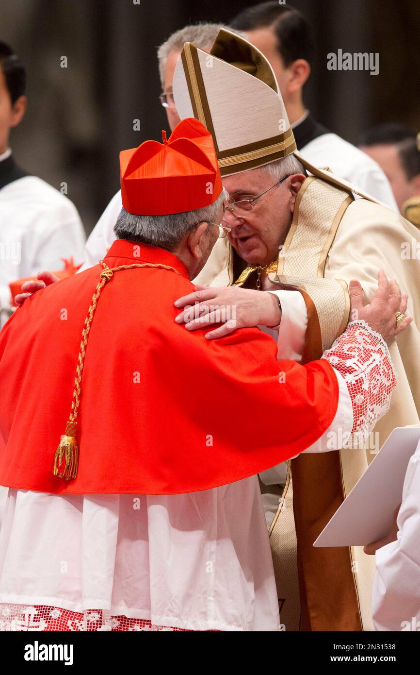 Newly elected Cardinal Pierre Nguyen Van Nhon is hugged by Pope Francis ...