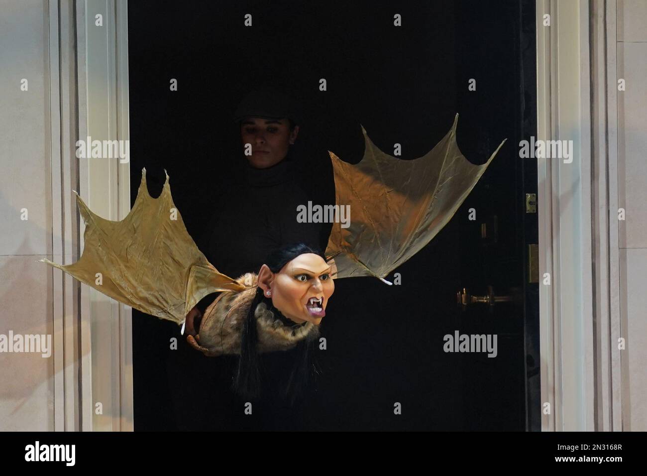 A cast member performs a musical number with the puppet of Priti Patel ...