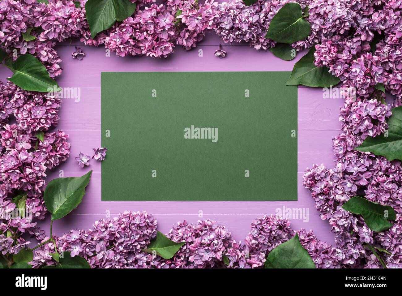 Frame of flowers and leaves with paper card note. Decor of lilac ...