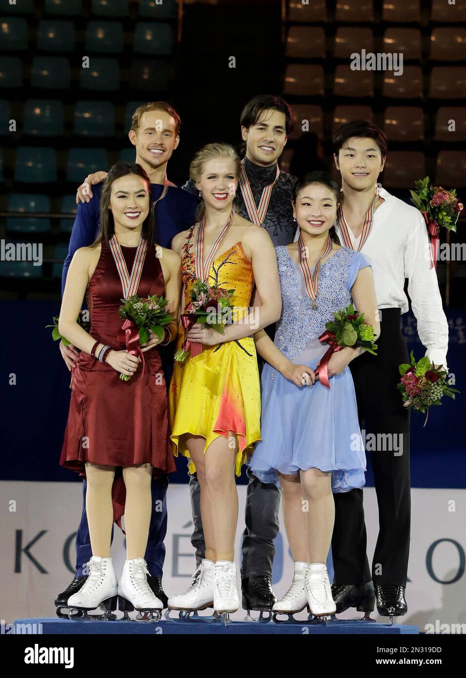 Gold medal winning pair Kaitlyn Weaver and Andrew Poje of Canada, center, silver medalist pair ...