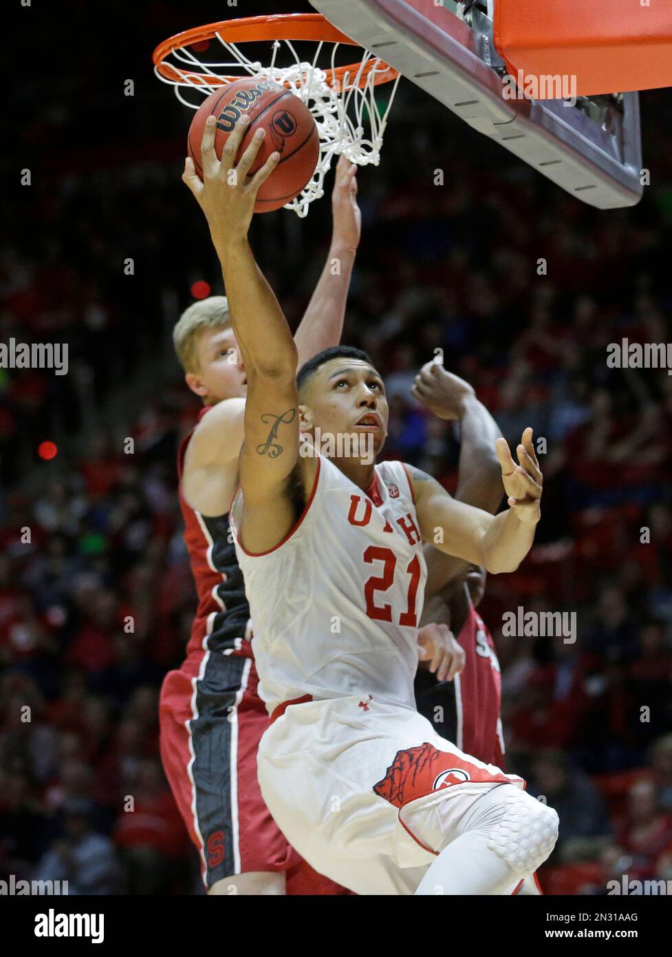 Utah forward Jordan Loveridge (21) goes to the basket as Stanford ...