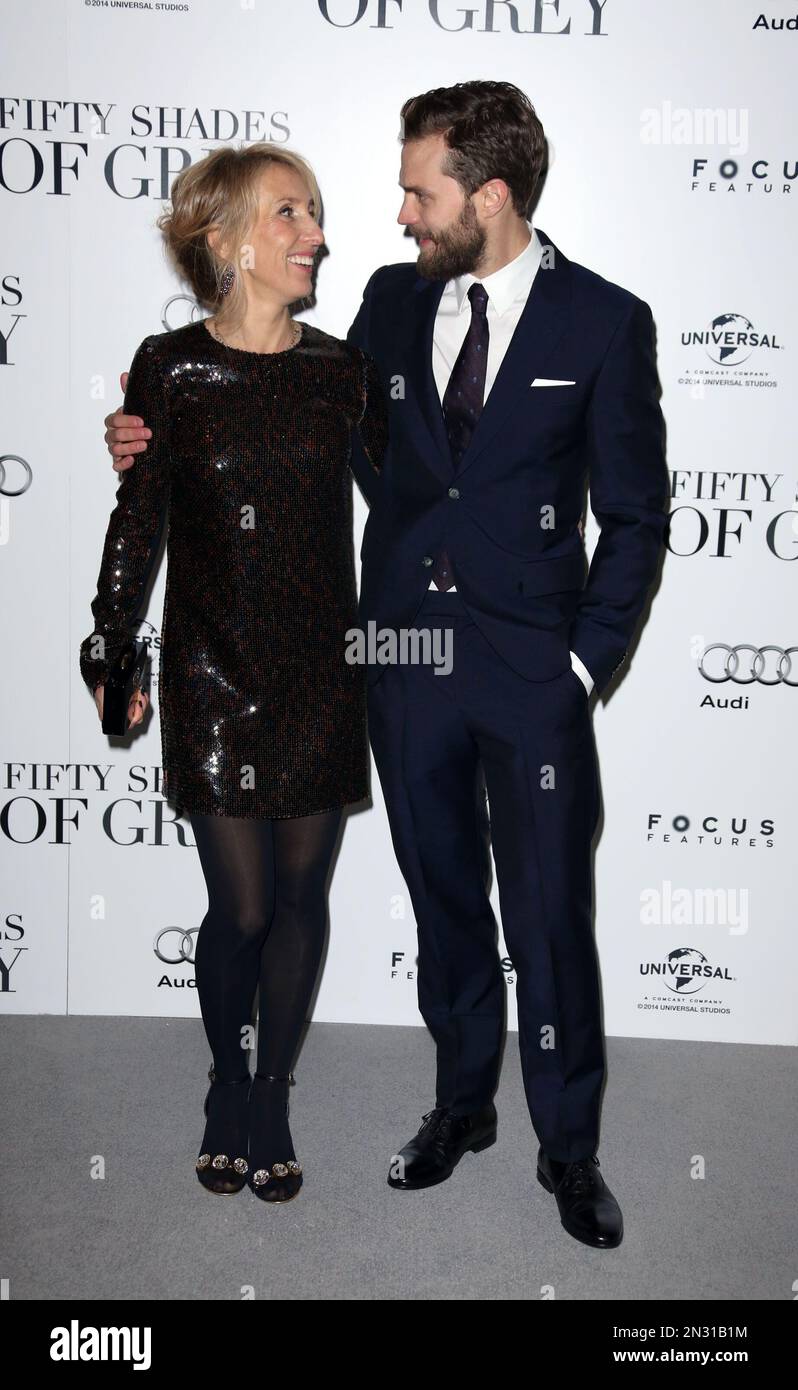 Sam Taylor-Johnson and Jamie Dornan poses for photographers upon ...