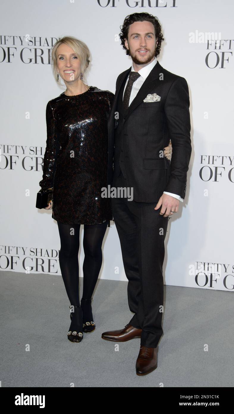 Sam Taylor-Johnson and Jamie Dornan pose for photographers at the UK ...