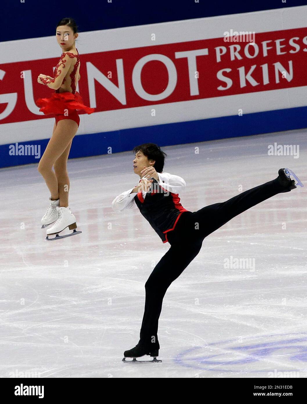 Pang Qing and Tong Jian of China perform during the pairs short program ...