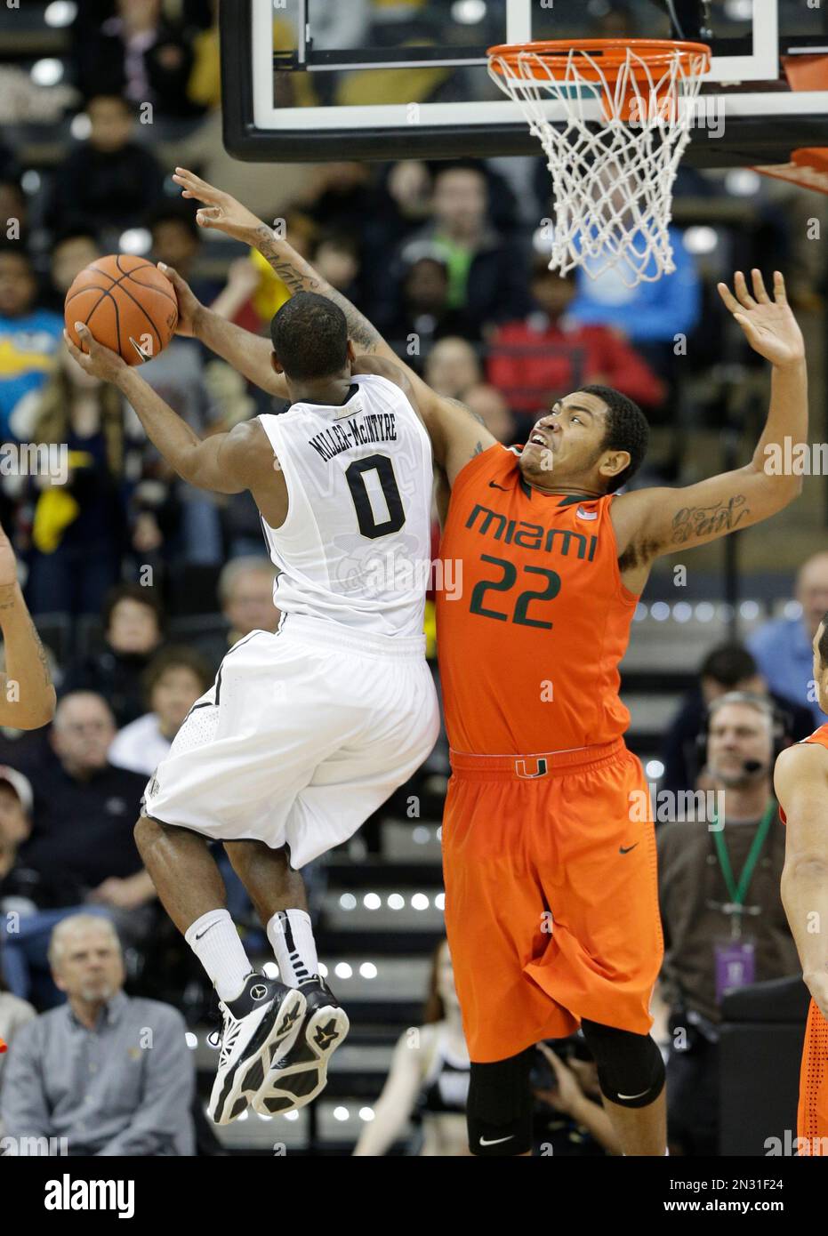 Wake Forest's Codi Miller-McIntyre (0) tries to shoot over Miami's Omar ...