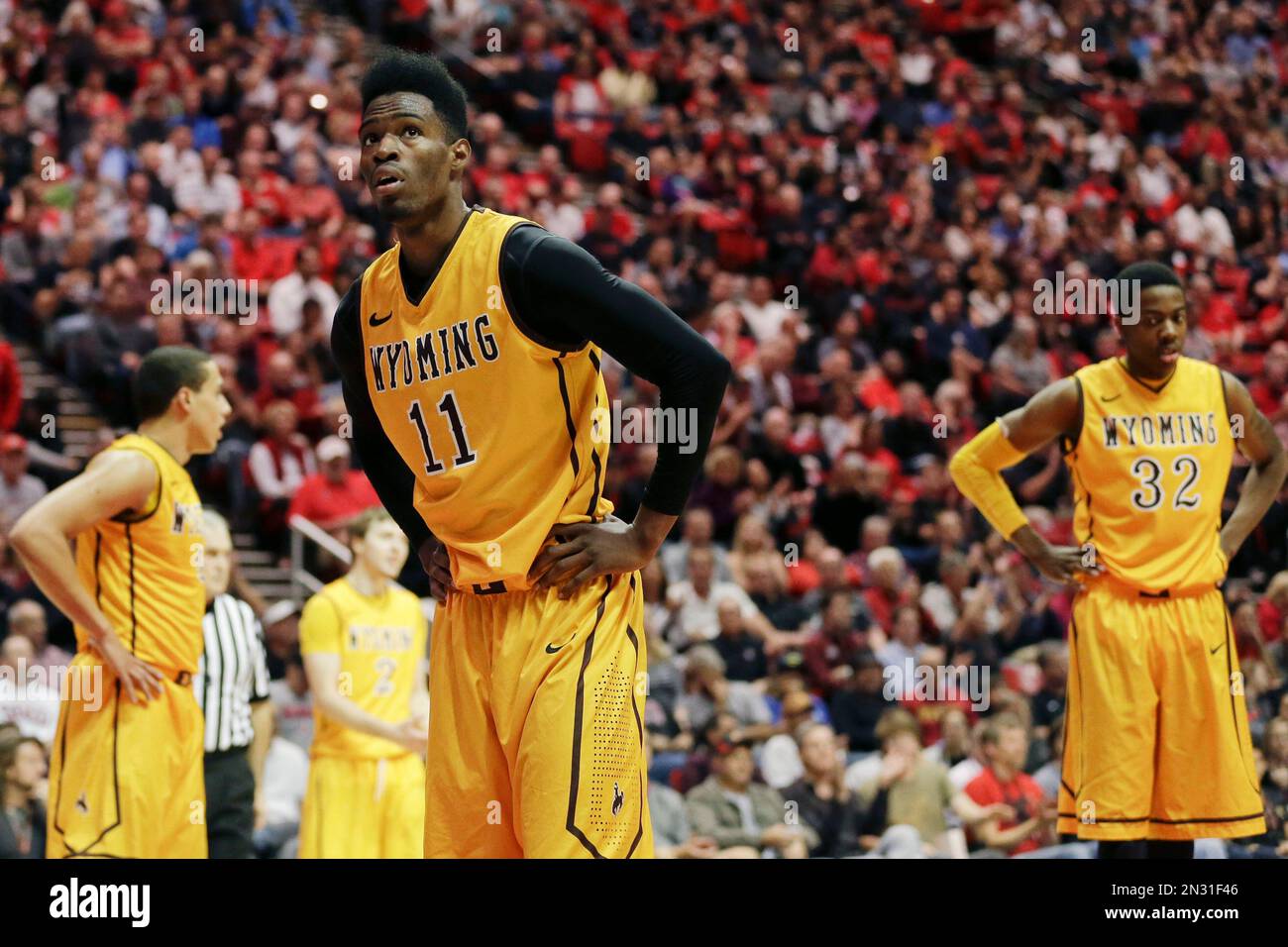Wyoming forward Derek Cooke Jr. (11) waits with teammates during the ...