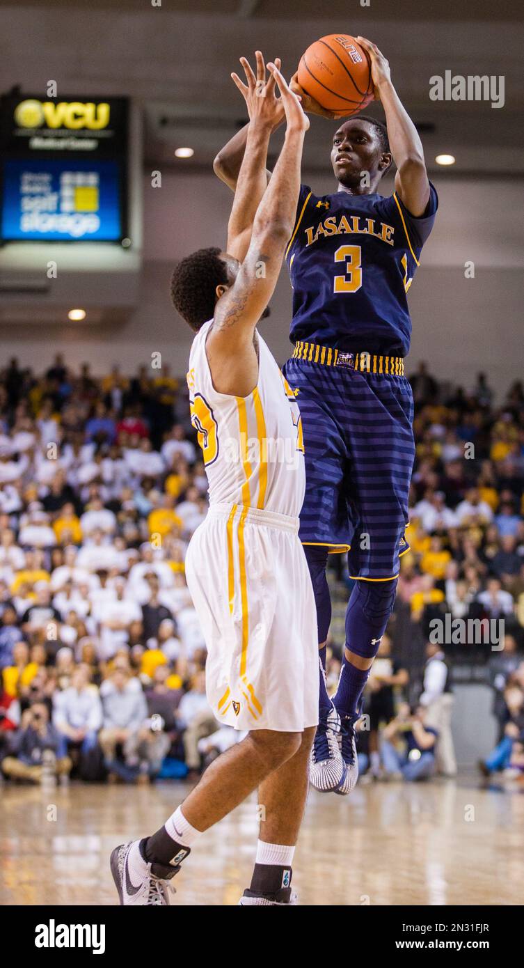 La Salle guard Cleon Roberts shoots over VCU guard Jordan Burgess ...
