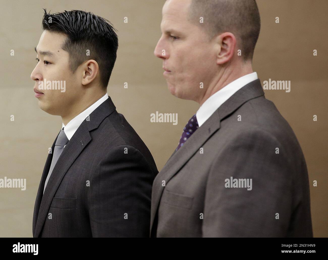 New York City rookie police officer Peter Liang, left, arrives at the ...