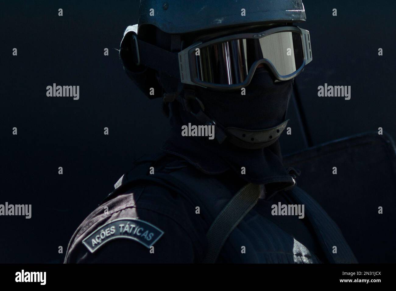A special operations (BOPE) Police officer takes position outside a BRT ...