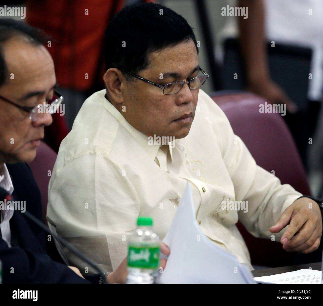 Resigned Philippine National Police Chief Gen. Alan Purisima examines ...