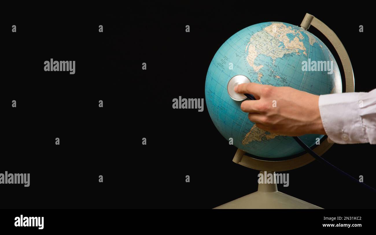 human hand examining the planet earth with a stethoscope Stock Photo ...