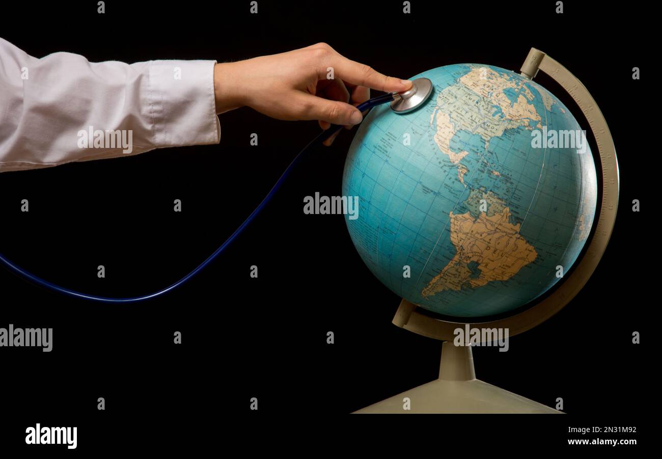 human hand examining the planet earth with a stethoscope Stock Photo ...