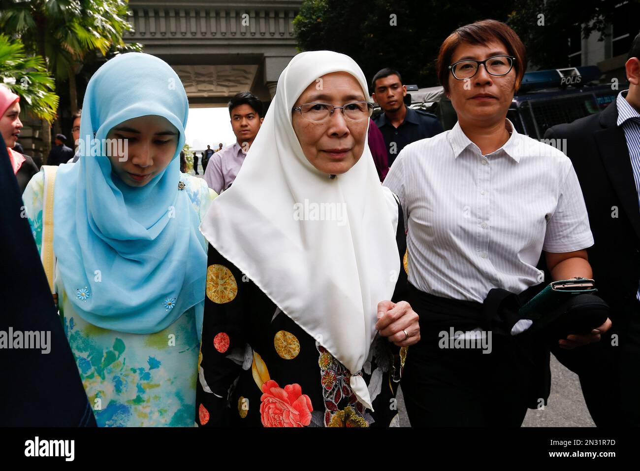 Wan Azizah, center, wife of Malaysian opposition leader Anwar Ibrahim ...