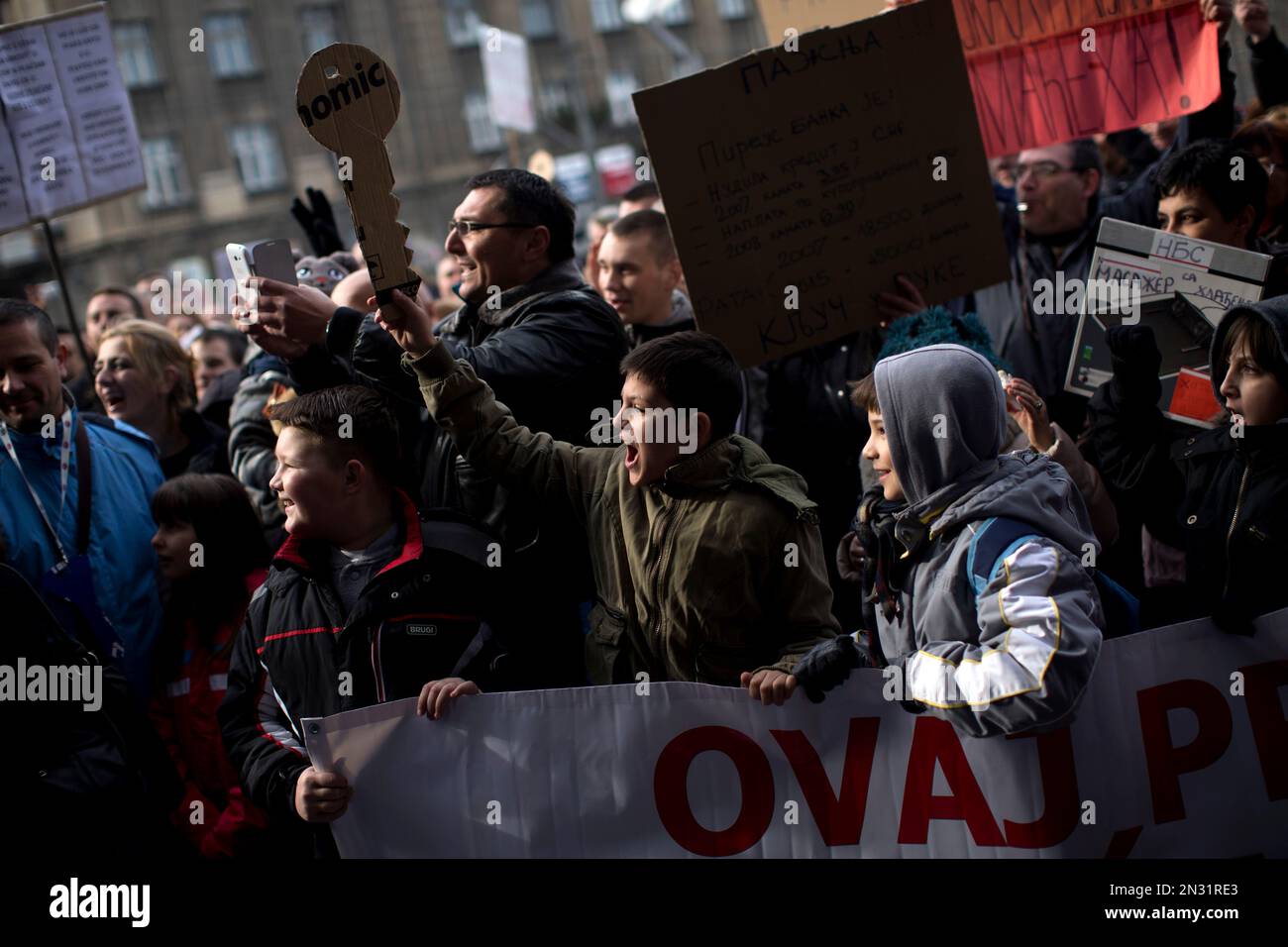 In this photo taken Saturday, Jan. 31, 2015, people chant as they ...