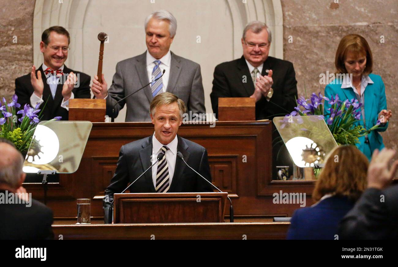 Tennessee Gov. Bill Haslam, front, is applauded as he arrives to ...
