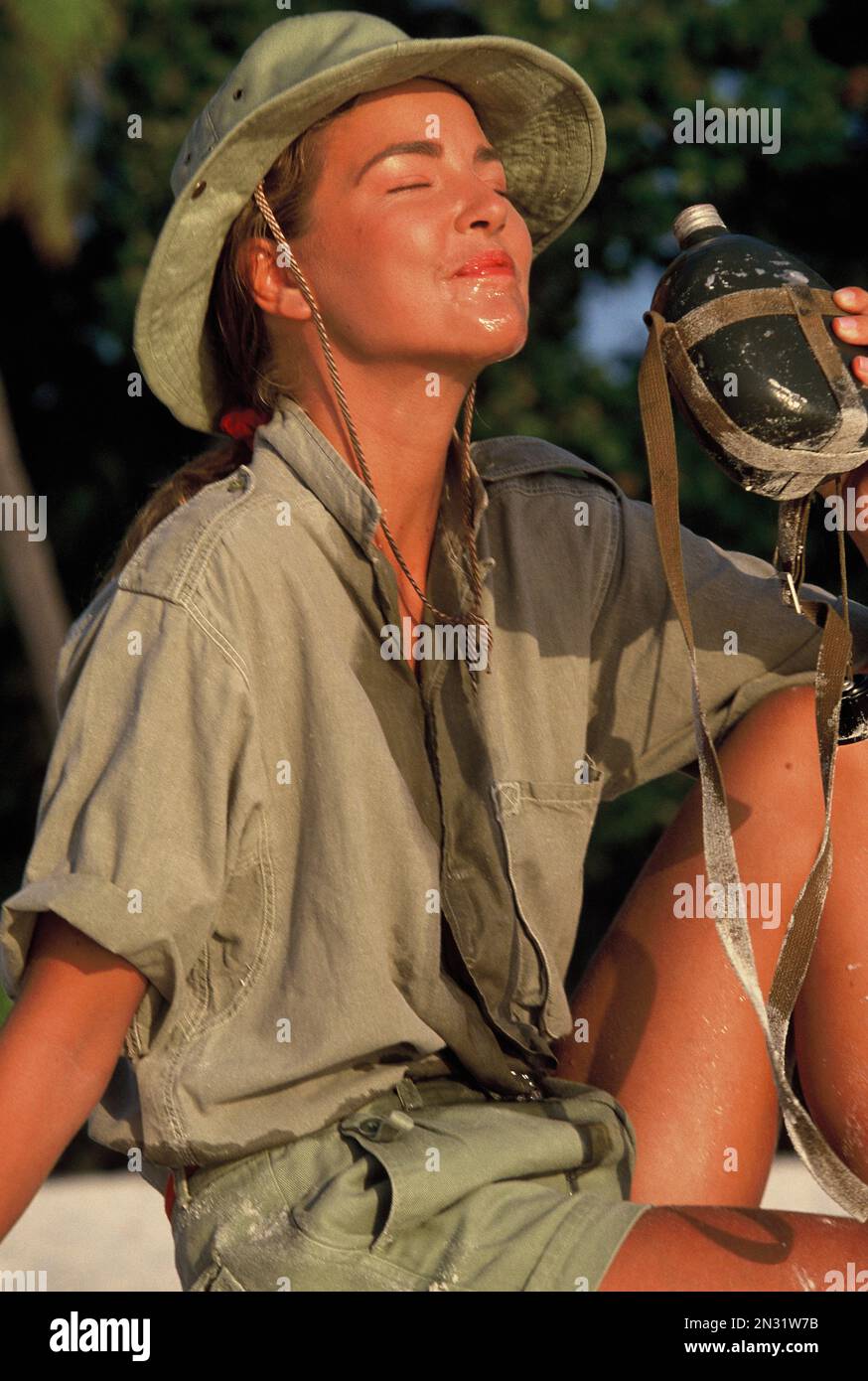 Maldives. Young woman in safari suit on tropical beach Stock Photo - Alamy