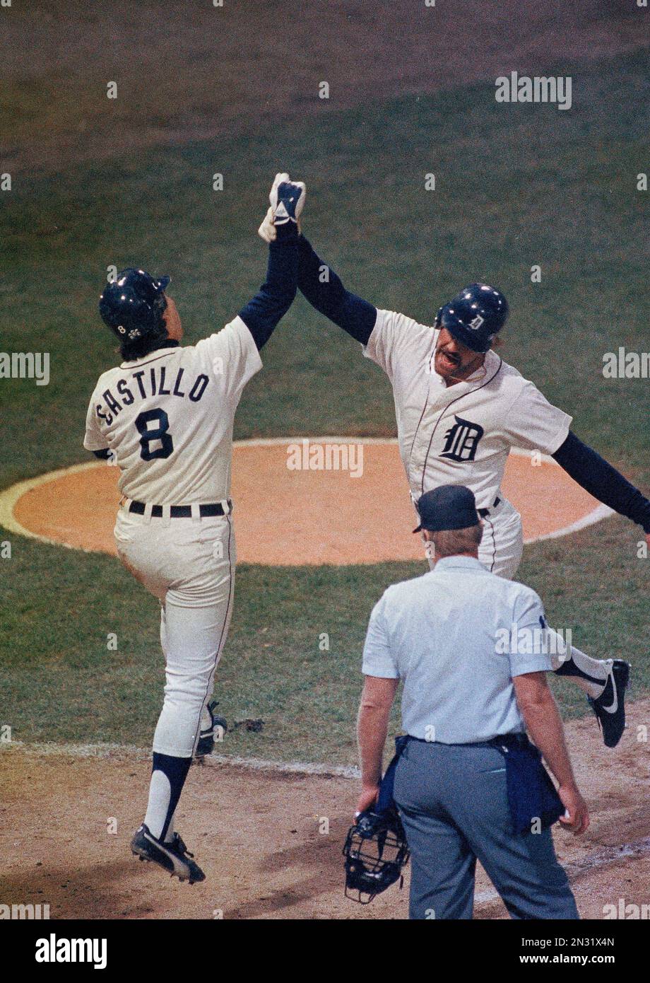 Detroit Tigers Kirk Gibson is greeted at the plate by teammate Marty ...