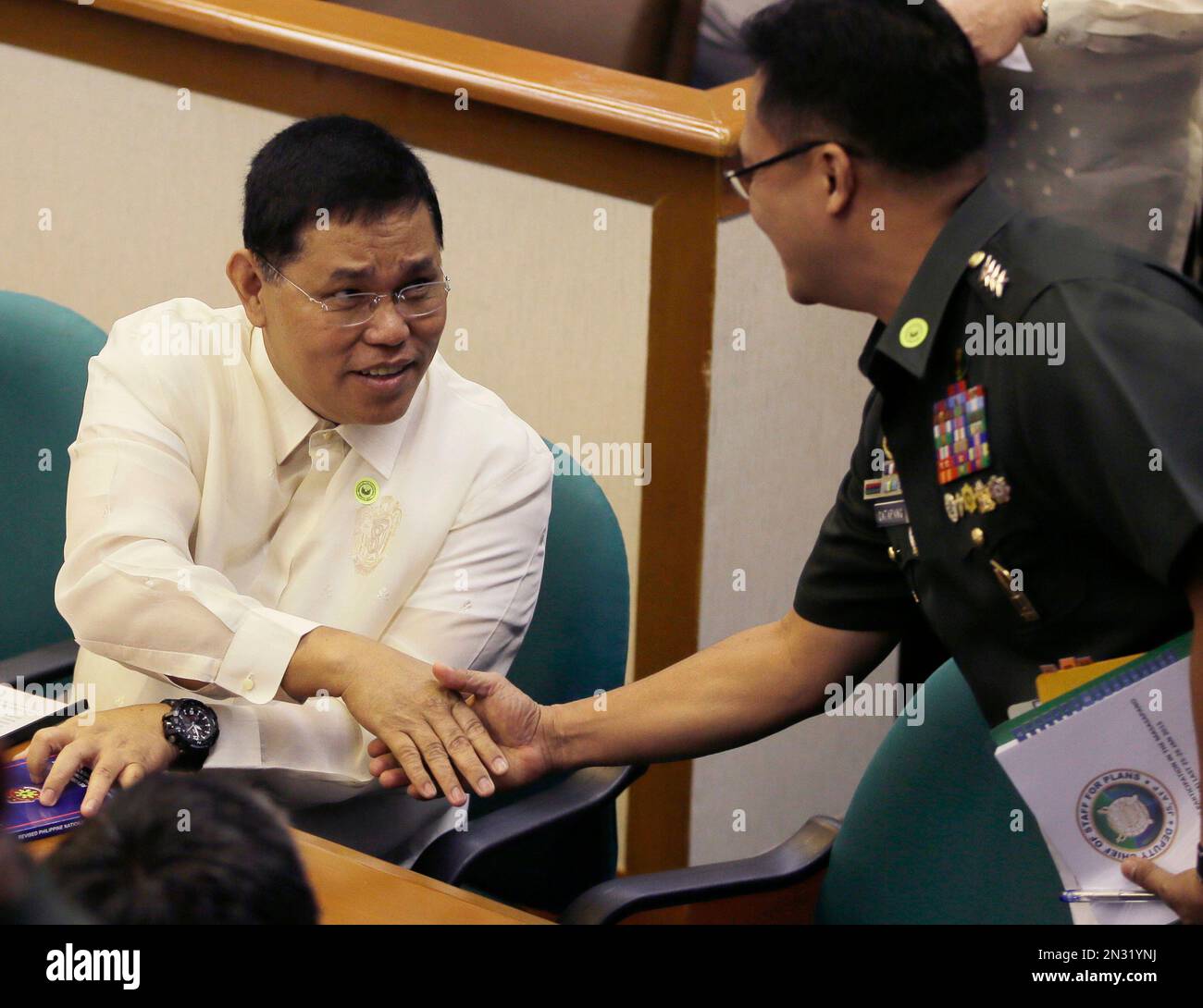 Resigned Philippine National Police Chief Gen. Alan Purisima, left, is ...