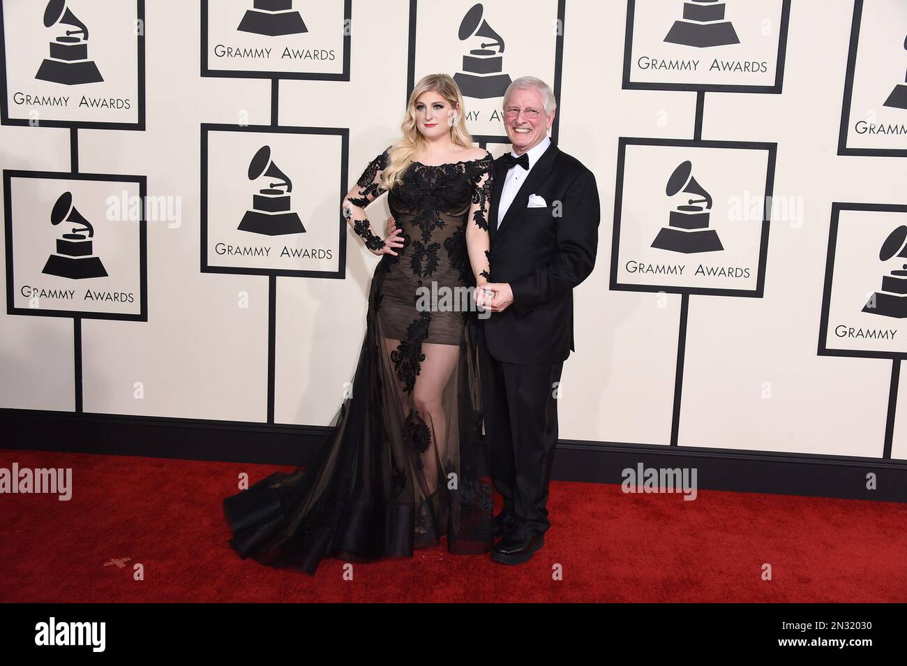 Meghan Trainor, left and Gary Trainor arrive at the 57th annual Grammy ...