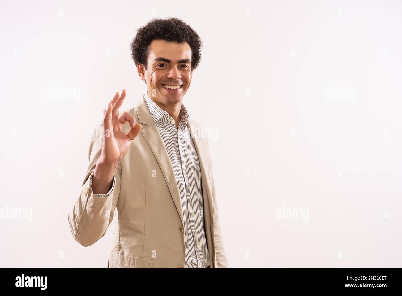 Portrait of happy and successful businessman showing ok sign Stock ...